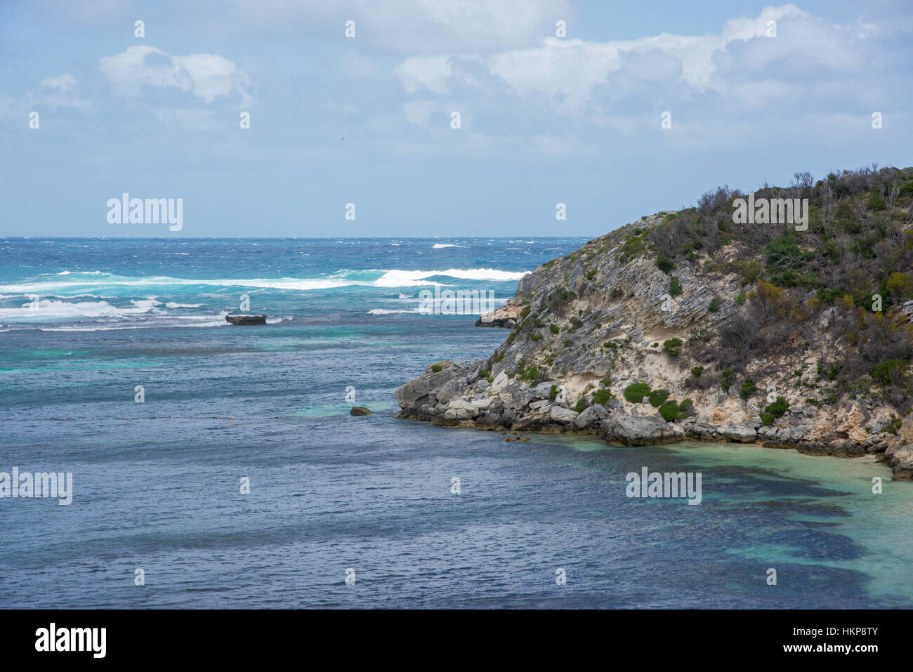 Rugged limestone outcropping with Indian Ocean waves at Rottnest Island ...