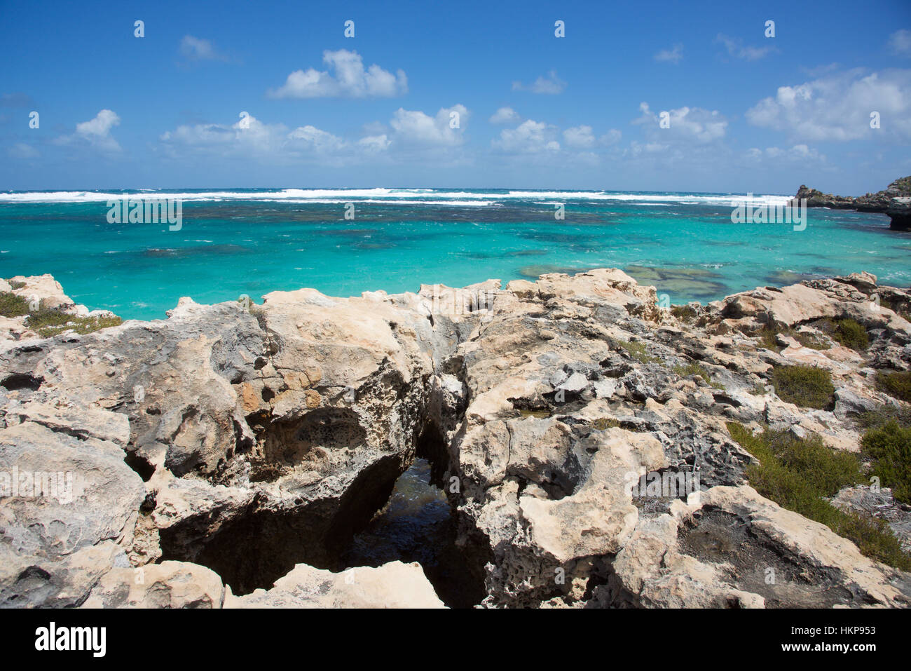 Natural limestone rock formations with turquoise Indian Ocean waters on ...