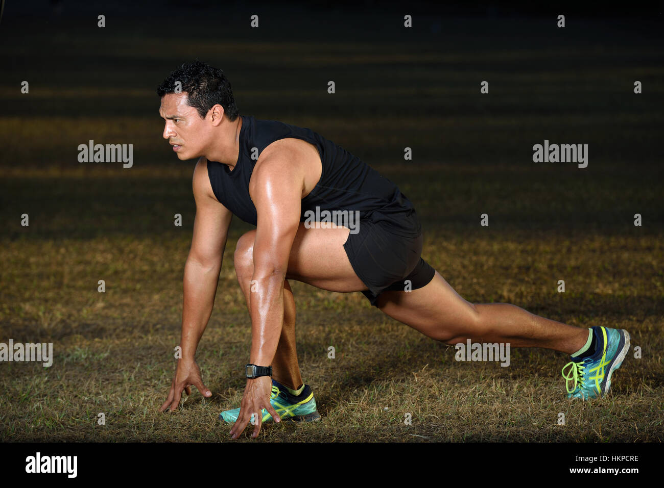 sport man ready to run on park grass Stock Photo - Alamy