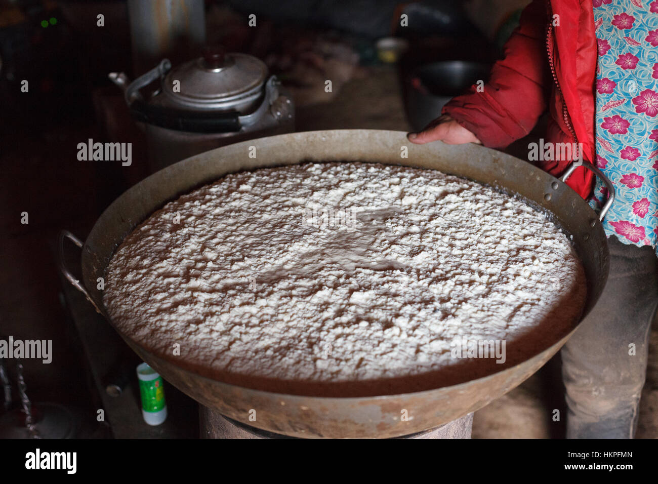 Cooking of a traditional milk product aaruul inside mongol yurt Stock ...