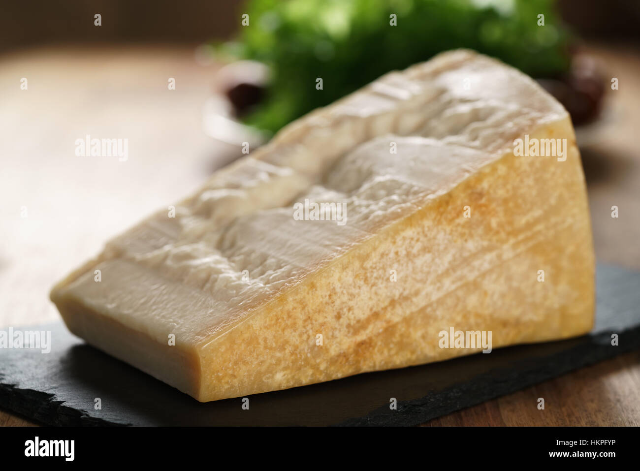 big chunk of italian parmesan cheese on slate board Stock Photo - Alamy