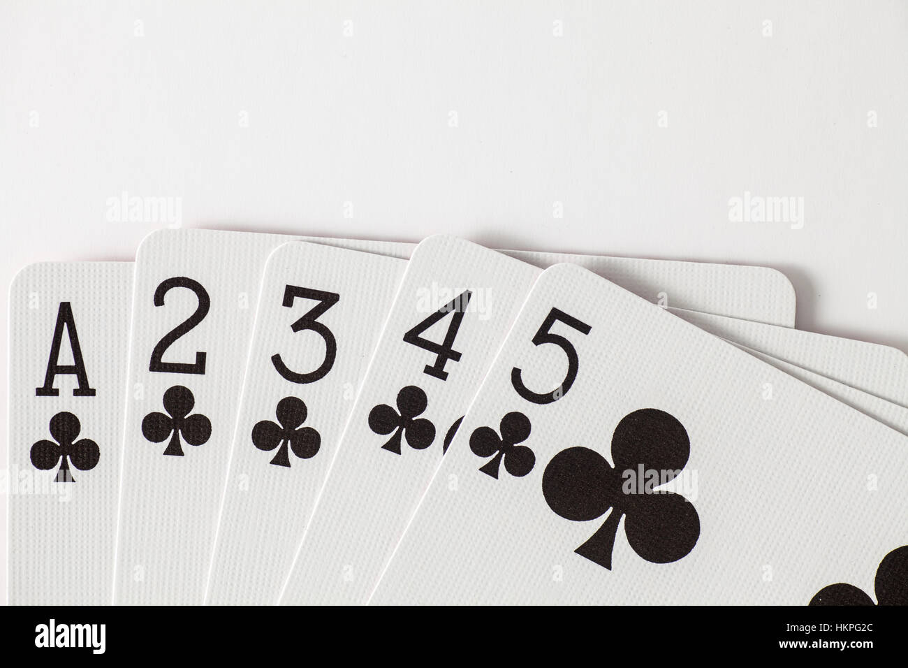 Playing Cards Low Straight Flush in Clubs with room at top Stock Photo ...