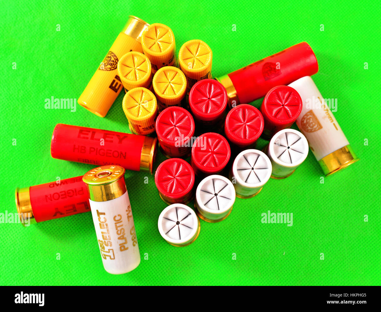 Red yellow 12 and 28 bore gauge shotgun cartridges Stock Photo - Alamy