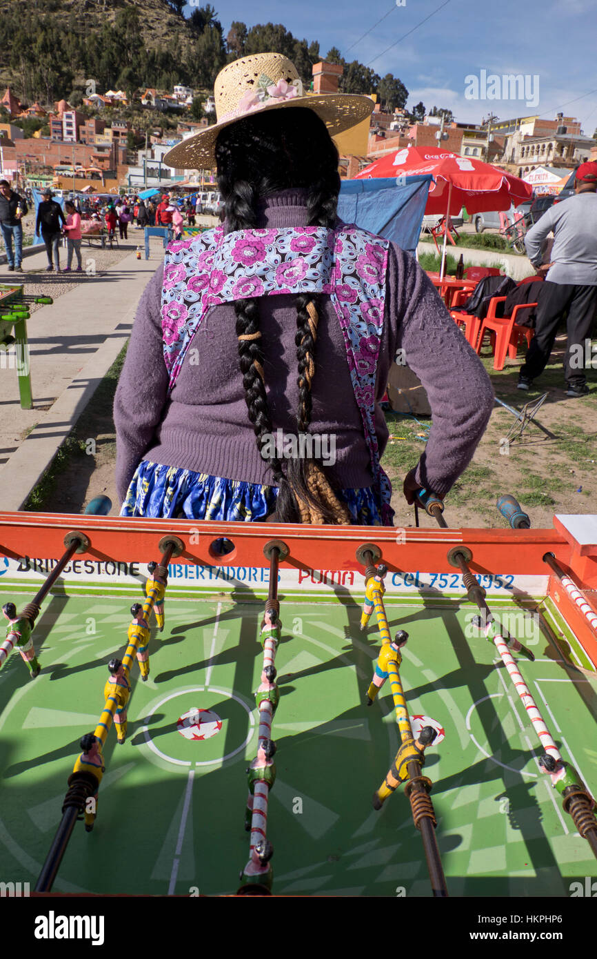 Native Aymara woman by table football facility in the resort of ...