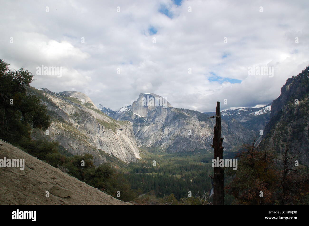 Half Dome covered in a layer of clouds in Yosemite Valley, CA. Picture ...