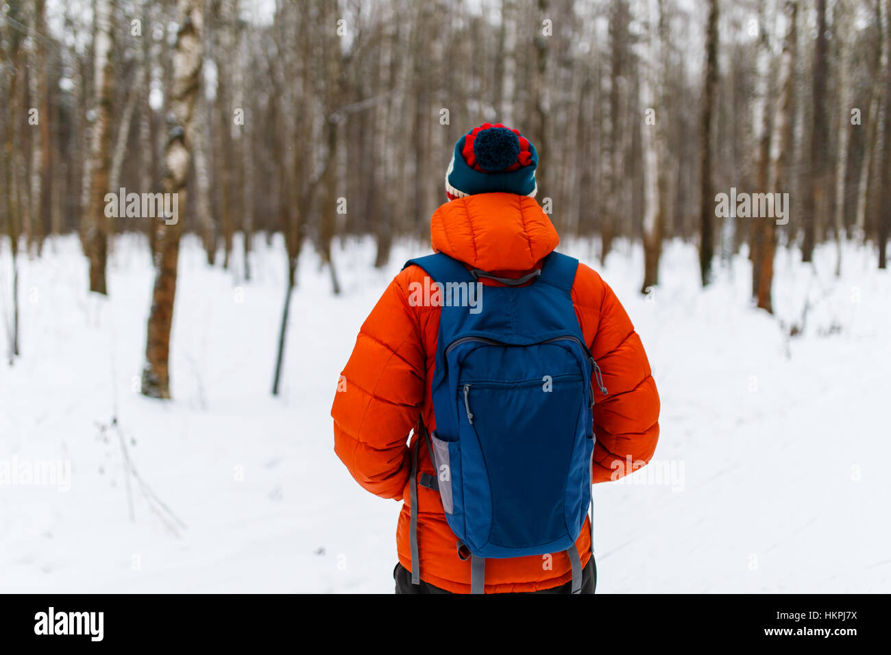 Guy with backpack in winter Stock Photo - Alamy