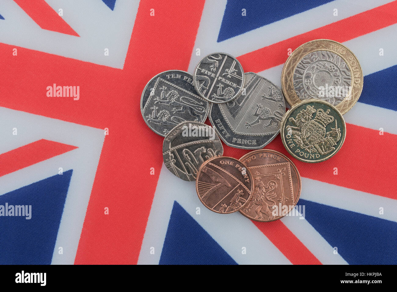 Loose change / UK coins on a Union Jack - metaphor for post-Brexit ...