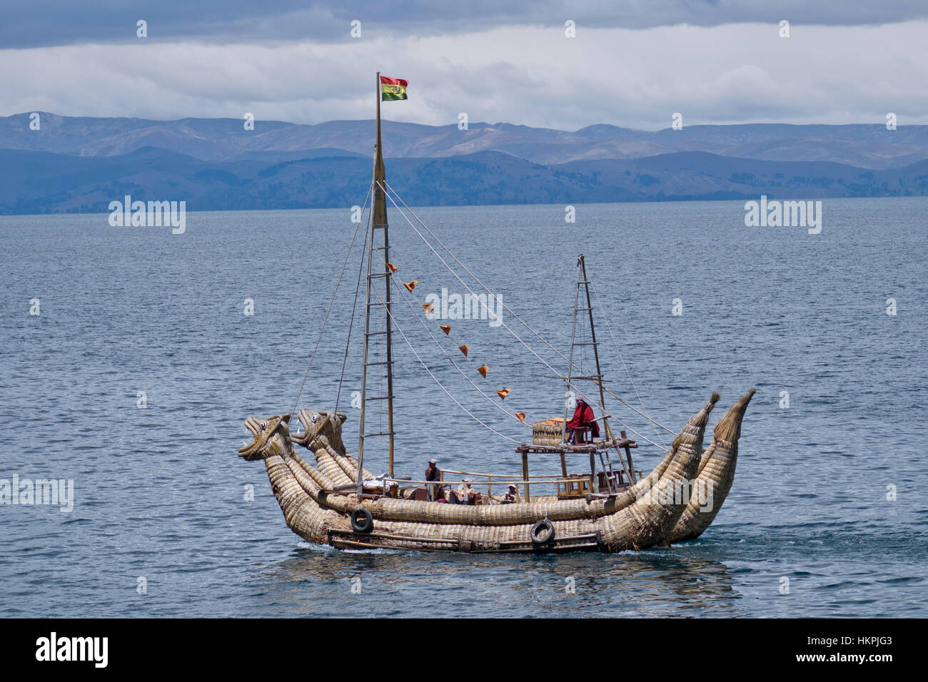 Traditional reed boat with tourists by Island of the Sun on Lake ...