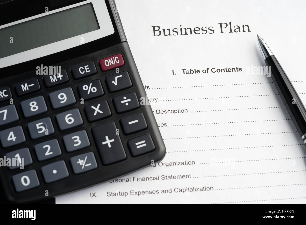 Business plan and pen close-up Stock Photo - Alamy