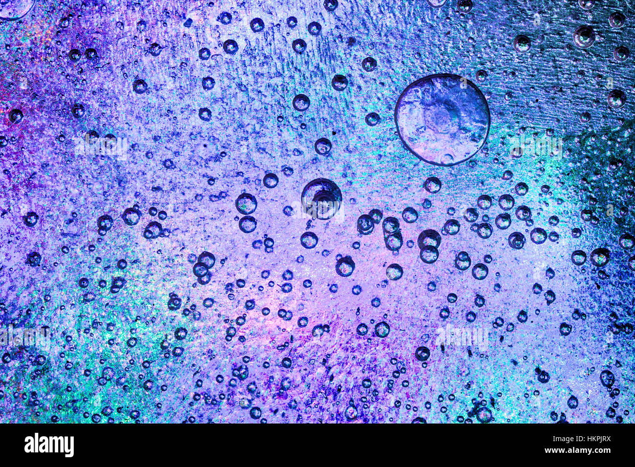 Frozen ice crystals with beautiful pink and blue colours below. Large ...