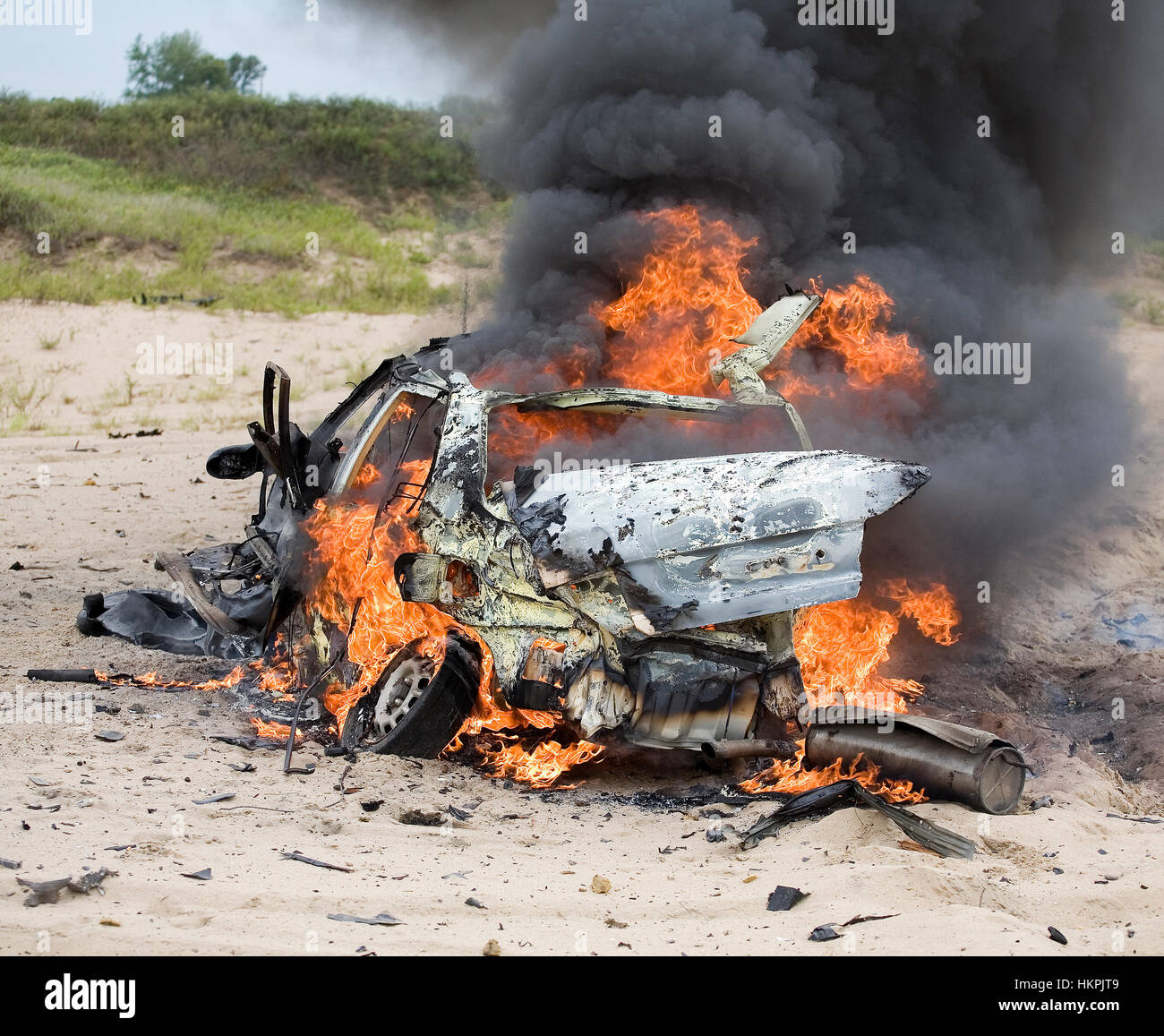 Small and smoking car minutes after it exploded Stock Photo - Alamy