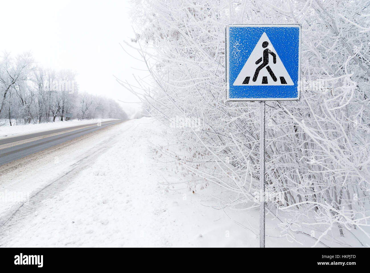 The road sign is on the snowy side Stock Photo - Alamy