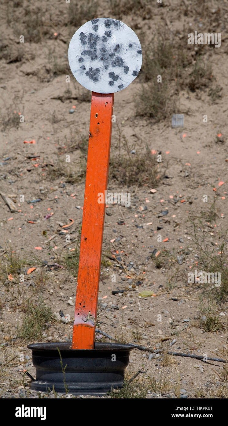 Steel target at a shooting range on an orange rod Stock Photo - Alamy
