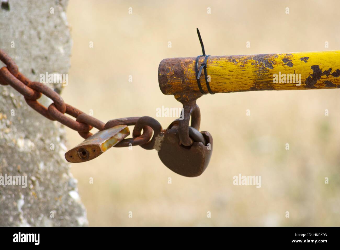 Rusty Barrier and chain with lock Stock Photo - Alamy