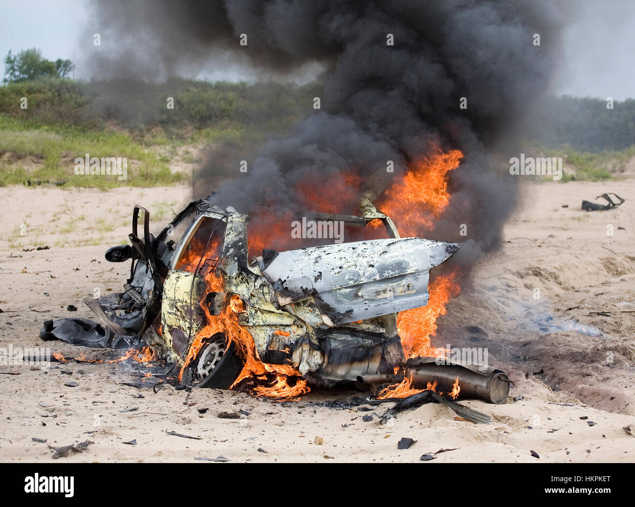 Burning car belching smoke seconds after the explosion Stock Photo - Alamy