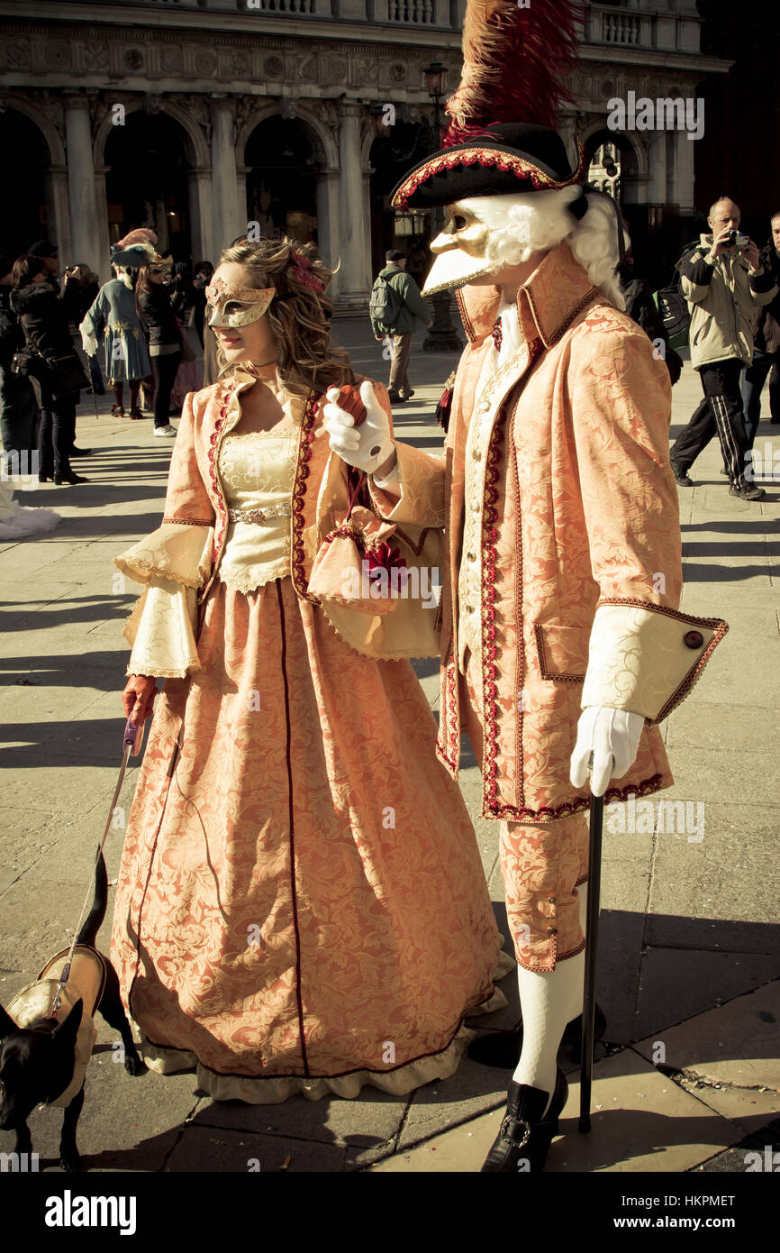 People with mask and fancy dress in carnival Stock Photo - Alamy