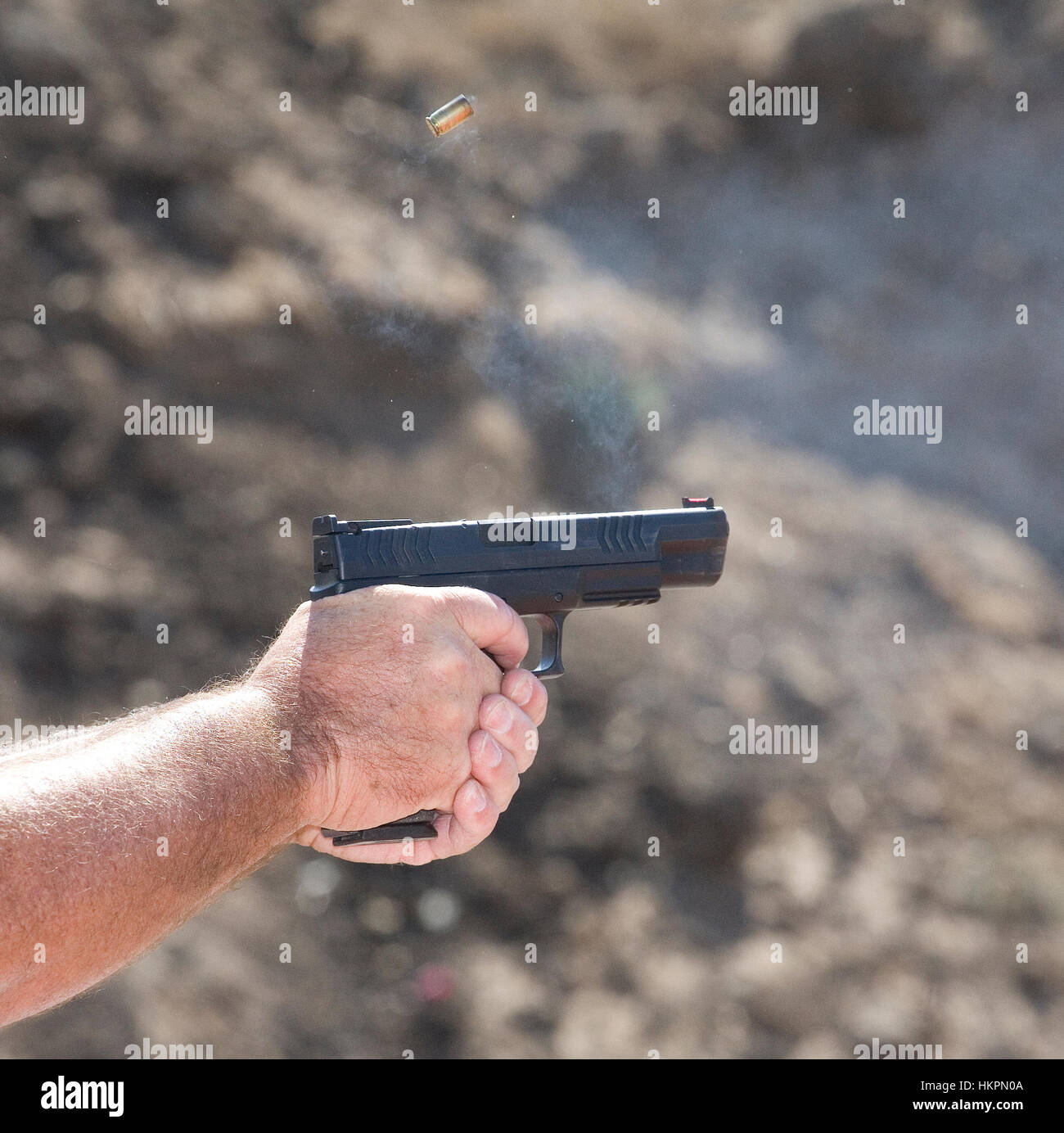 Spent shell casing that has just been ejected from a handgun Stock ...