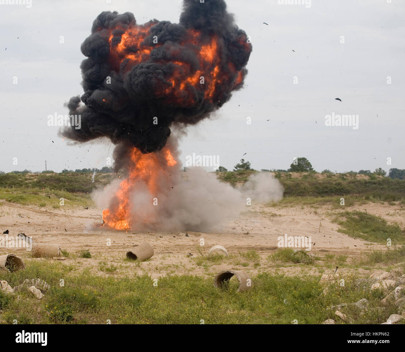 Car that has just exploded with smoke and debris in the air Stock Photo ...