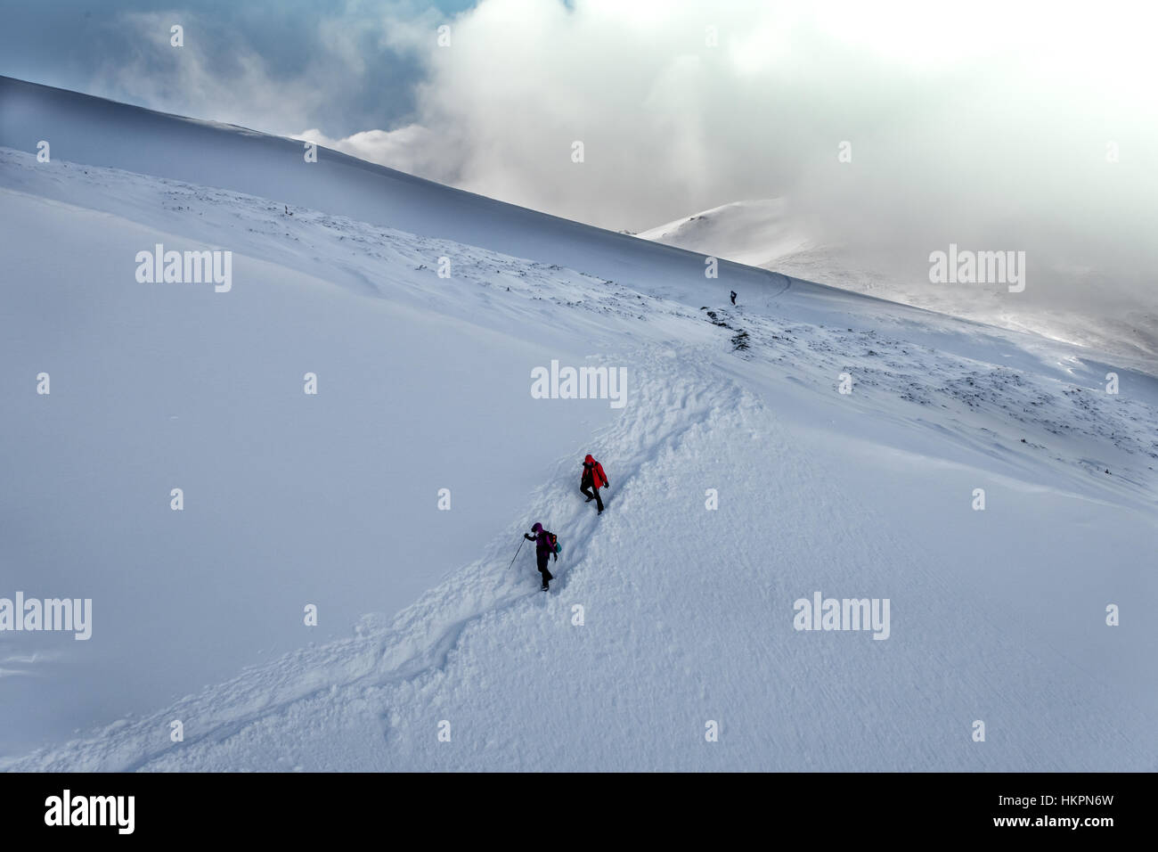Group hiking on snow-covered mountains in winter Stock Photo - Alamy