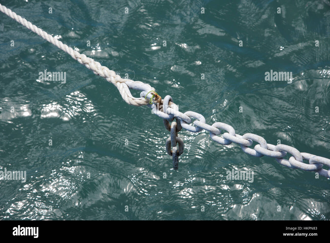 Nautical chainlink and knotted rope hooked together with the Indian ...