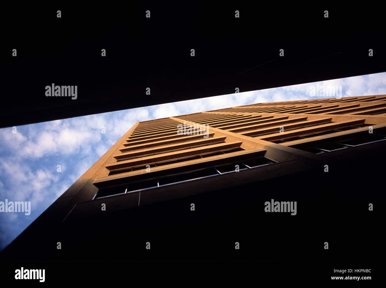 Building abstract looking up through alley way Stock Photo - Alamy
