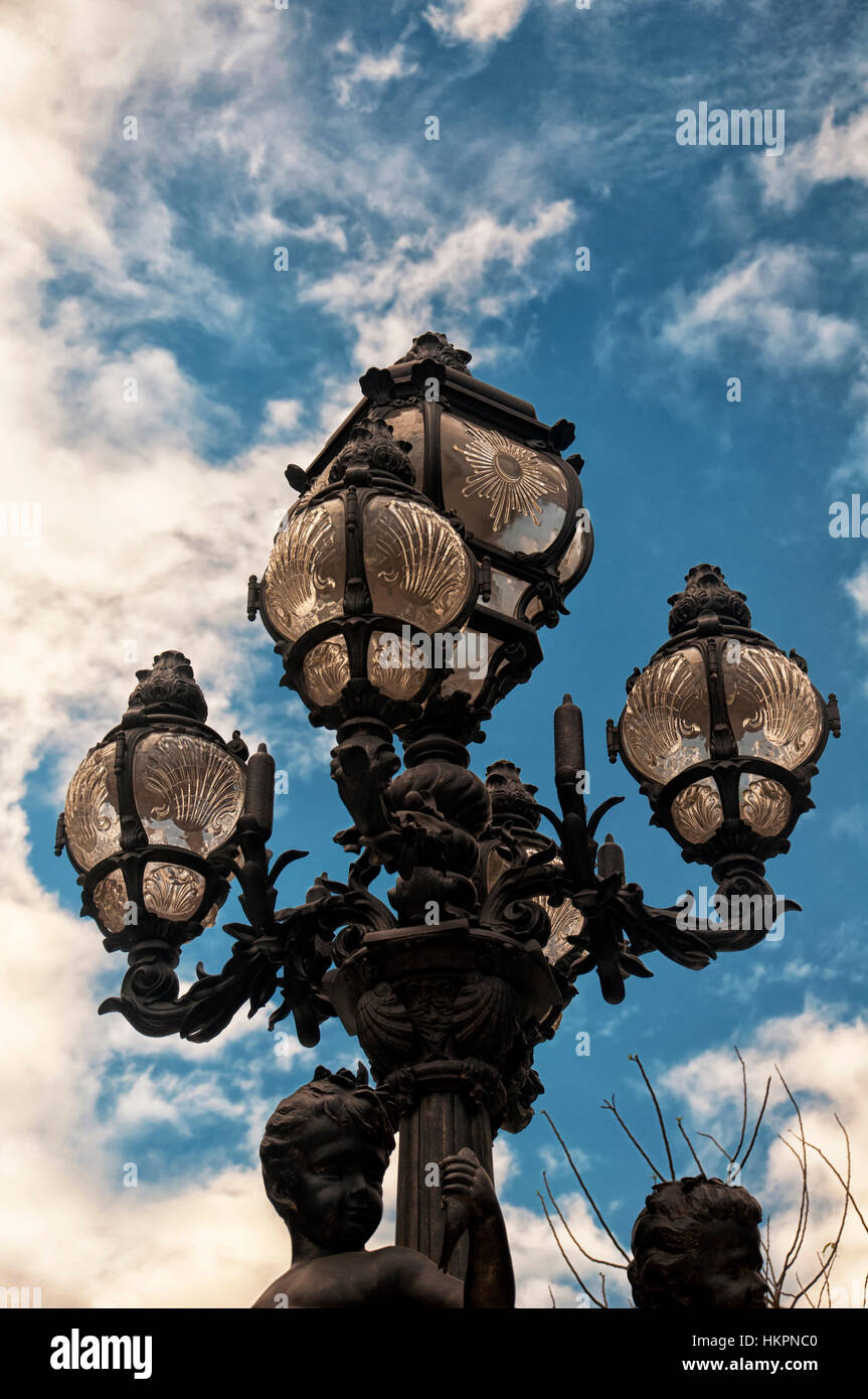 A decorative lamp post against a blue sky and white clouds at hotel in ...