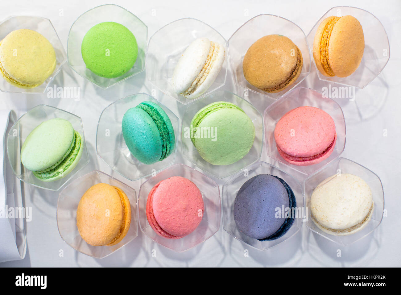 Many coloured macaroons on white table close-up Stock Photo - Alamy