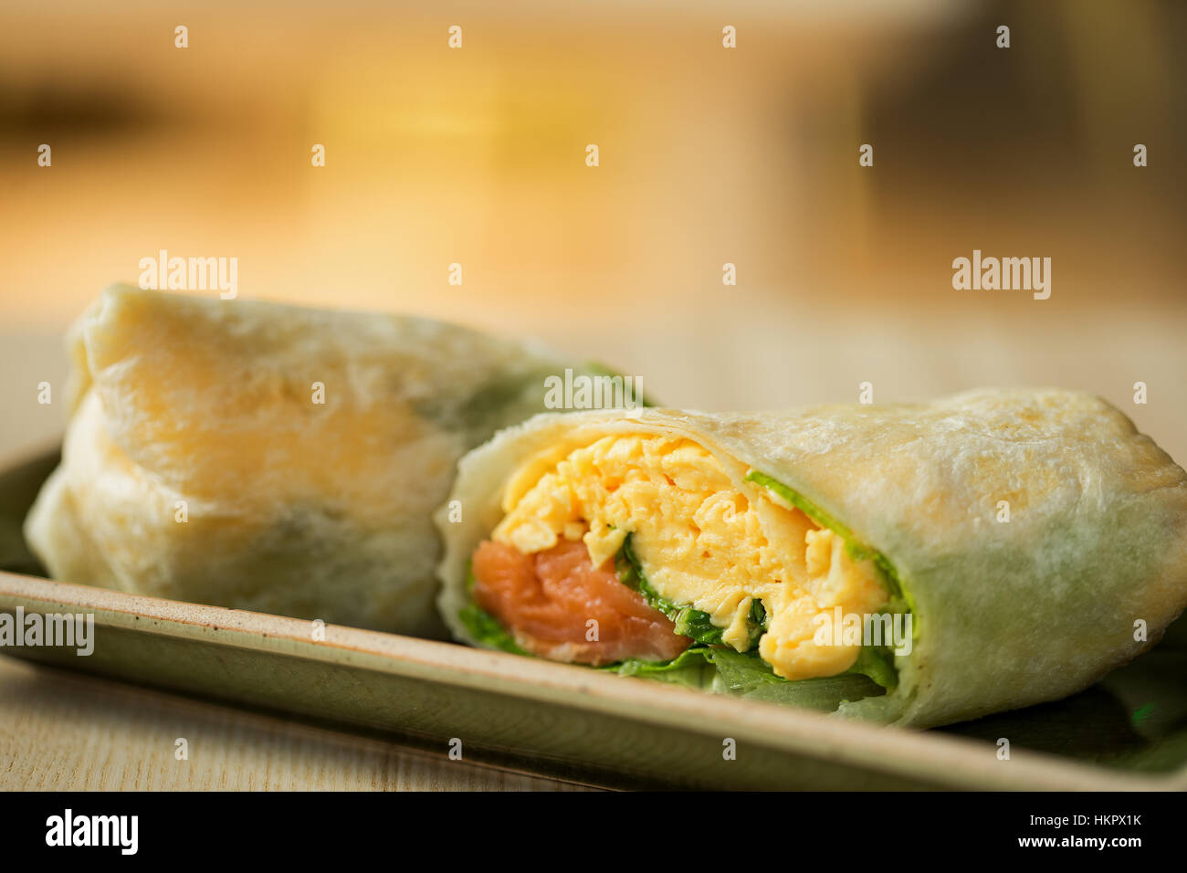 breakfast burrito with cheese, eggs and heirloom cherry tomato, salmon ...