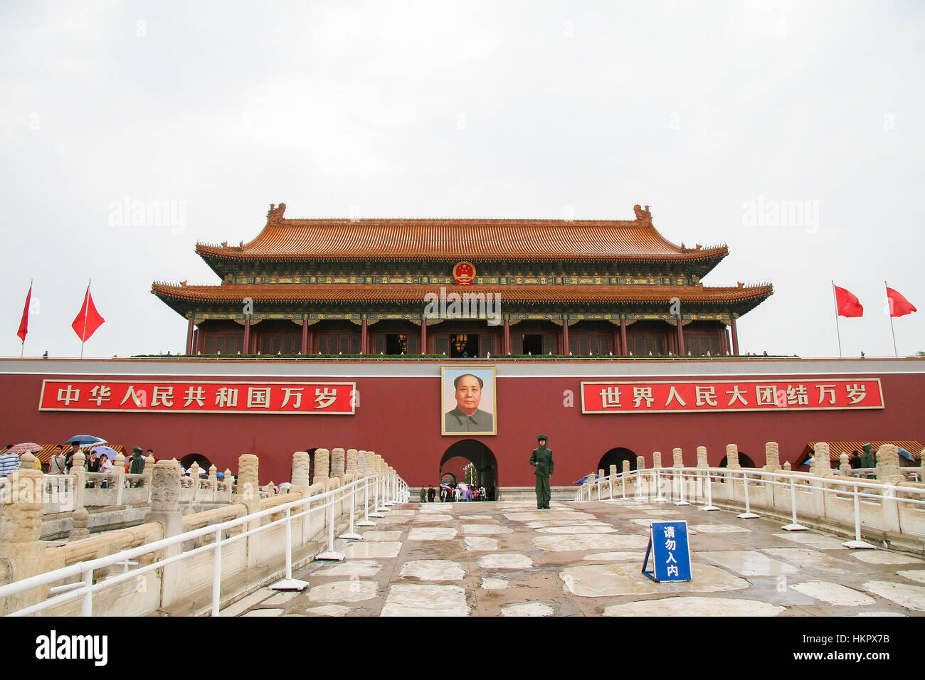Chinese soldier stands guard in front of a portrait of Mao Zedong in ...