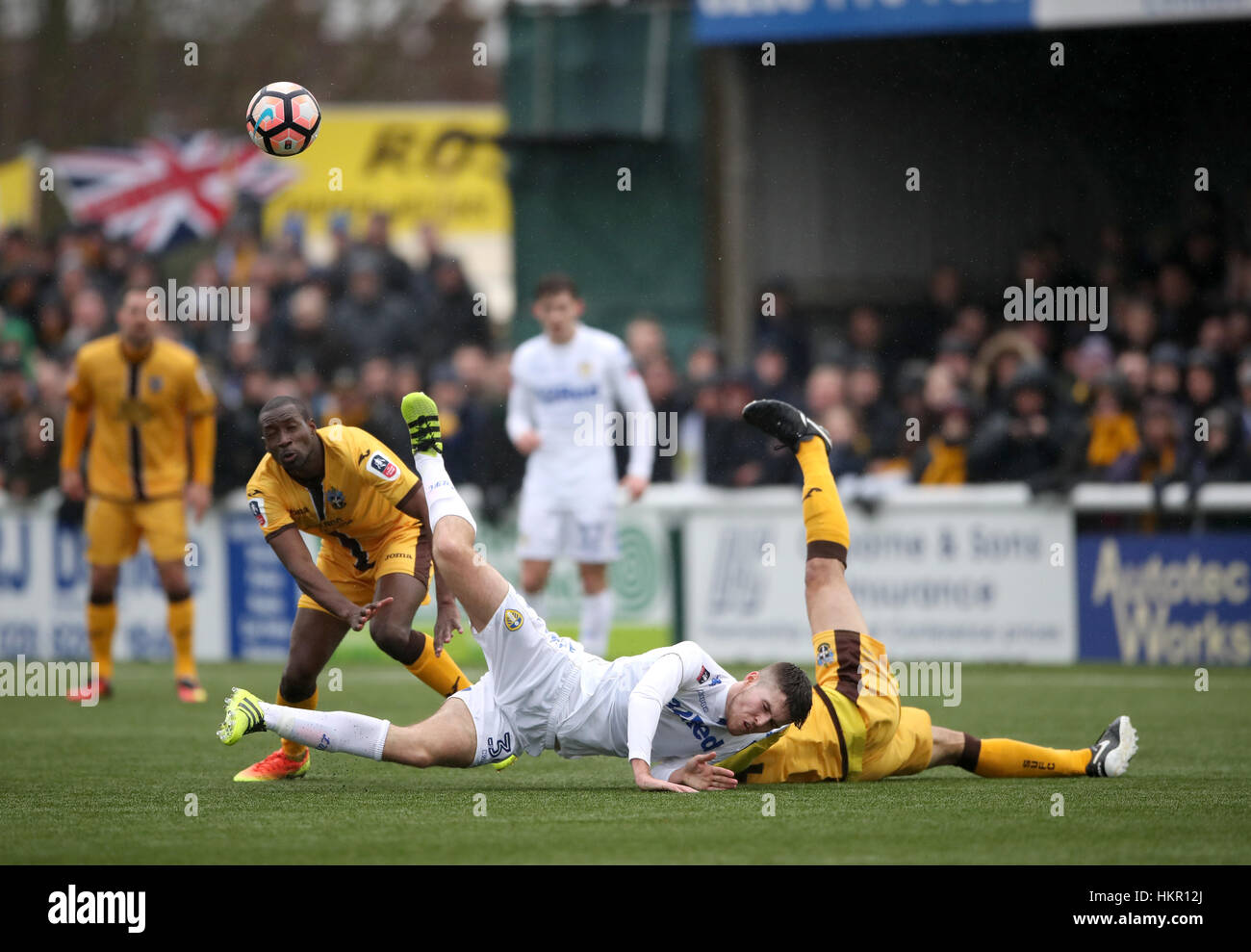 Leeds United's Paul McKay (centre) and Sutton United's Maxime Biamou ...