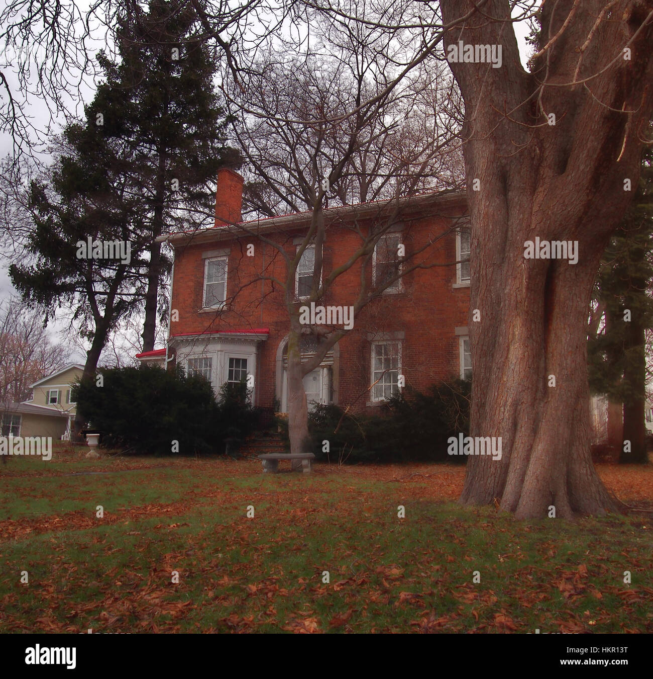 brick home in autumn Stock Photo - Alamy