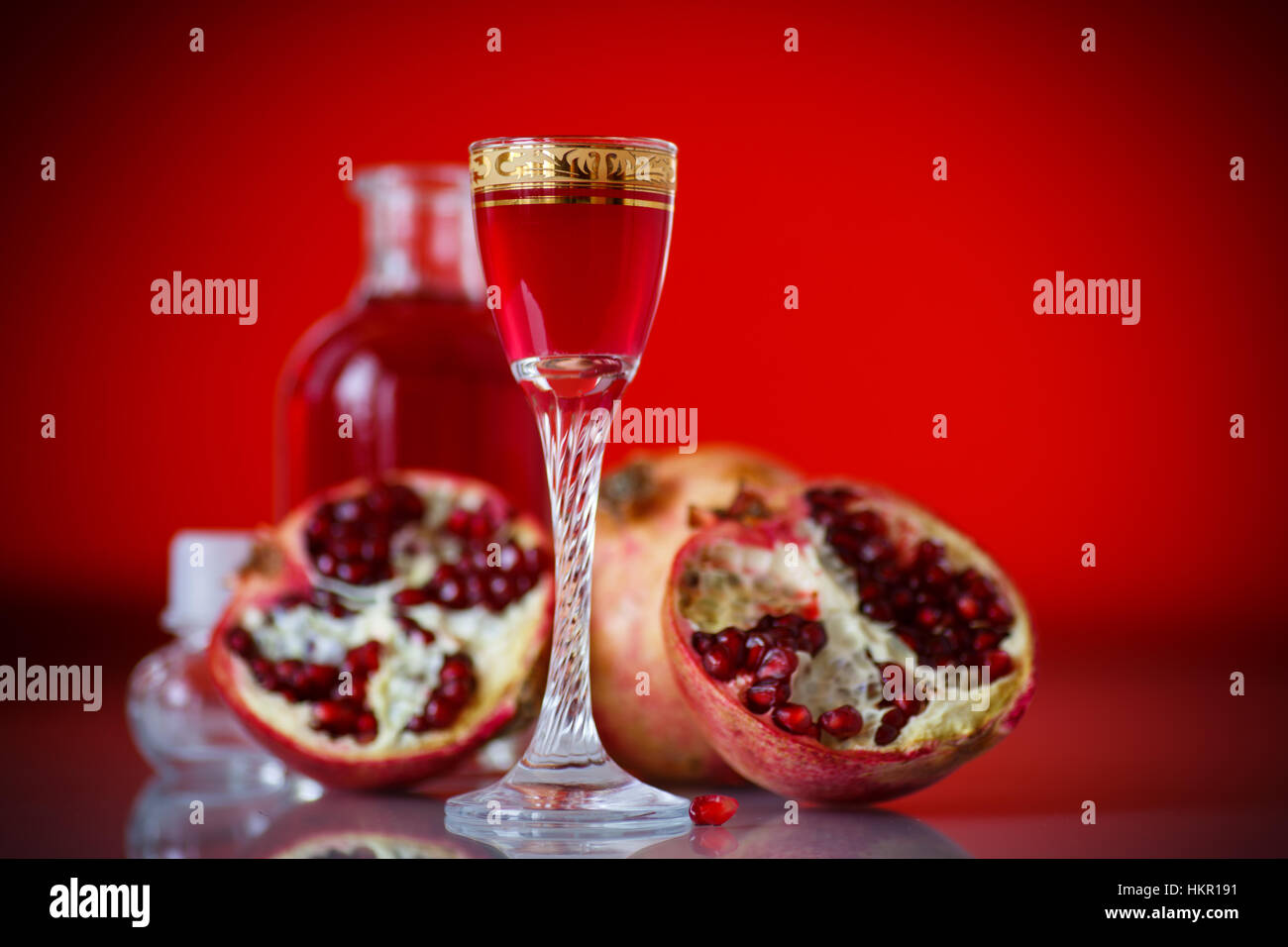 sweet pomegranate alcoholic cordial in the decanter with a glass Stock ...