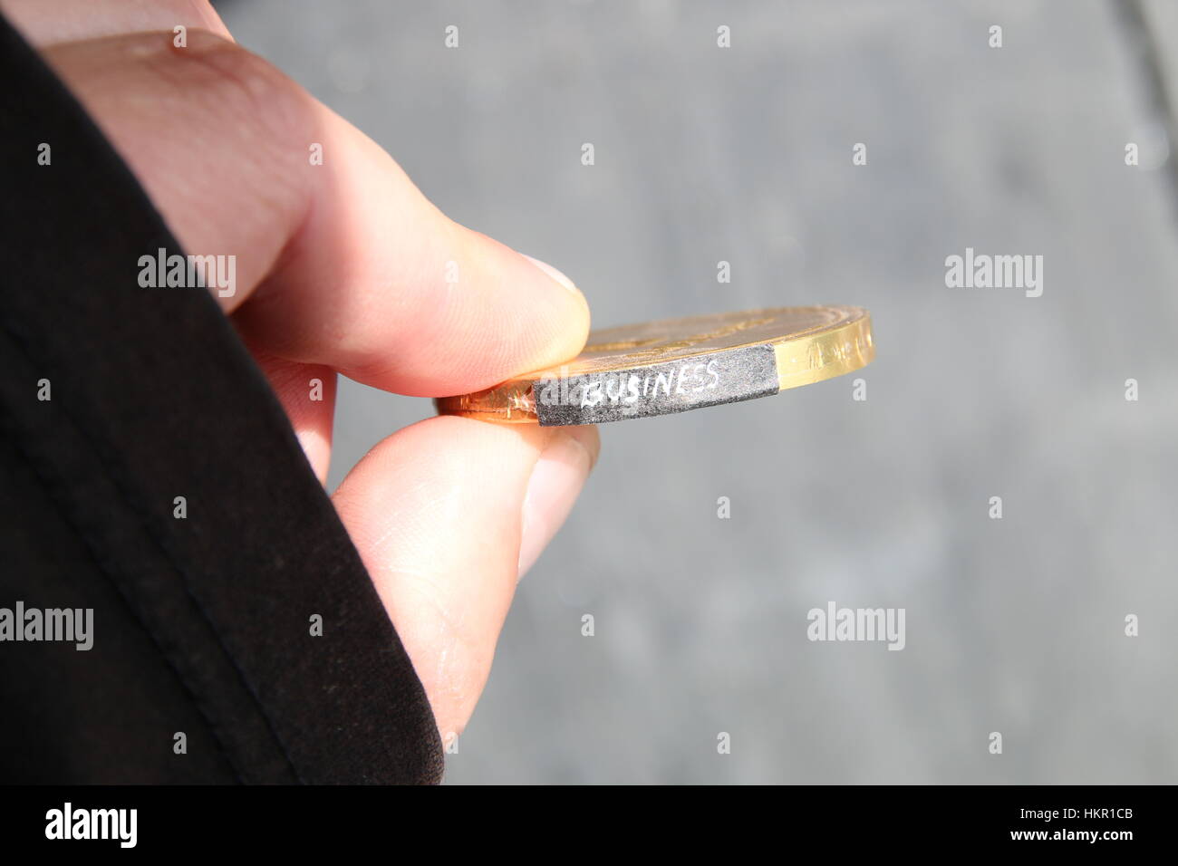 business - writing on the gold coin Stock Photo - Alamy