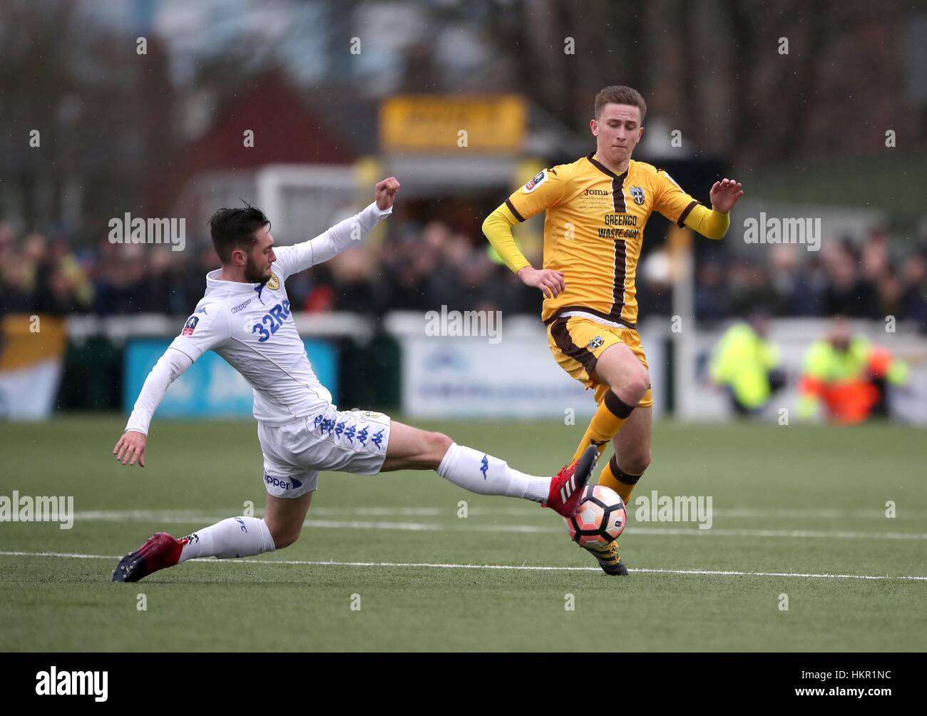 Leeds United's Matt Grimes (left) and Sutton United's Adam May battle ...