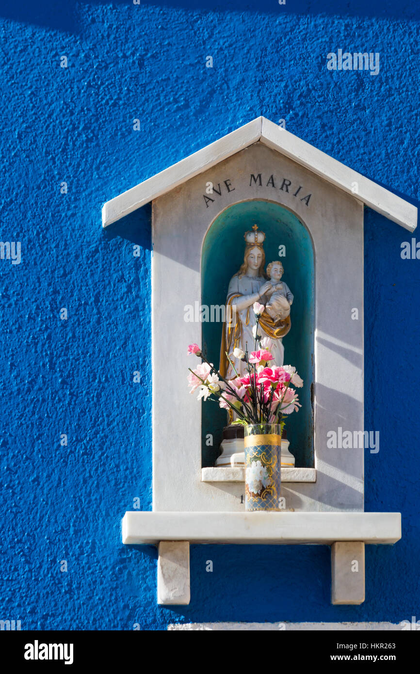 Ave Maria memorial with flowers on blue wall at Burano - Bright colors ...