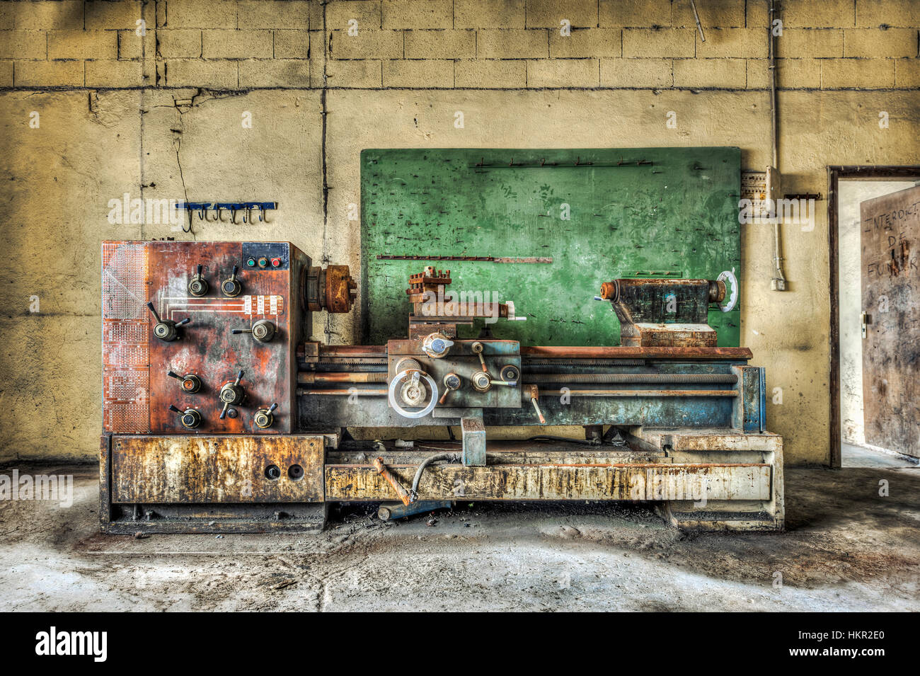 Old lathe turning machine in an abandoned factory Stock Photo - Alamy