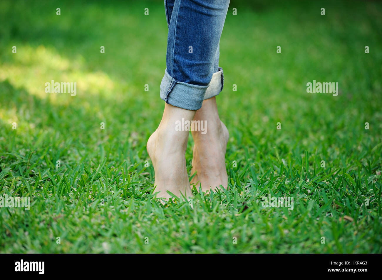 bare foot stand on green grass in ballet pose Stock Photo - Alamy