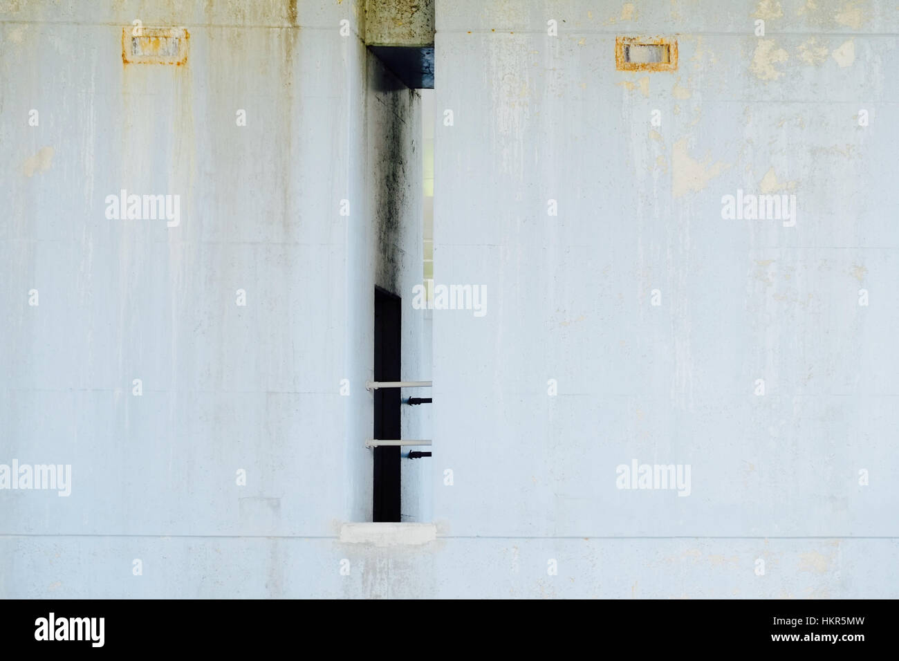 Concrete wall with door and railing under the bridge Stock Photo - Alamy