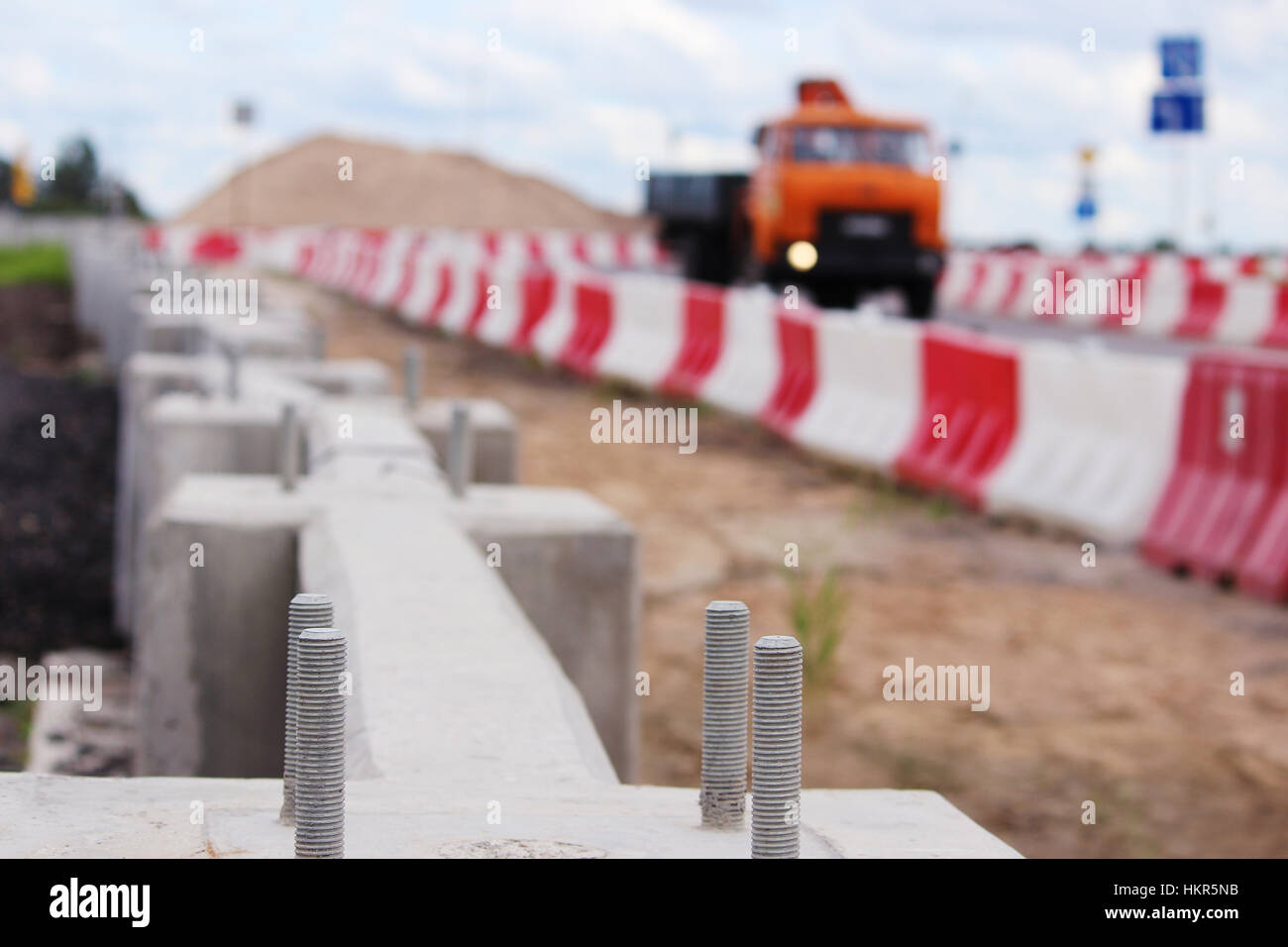 construction of road junction at the viaduct with concrete barriers and ...