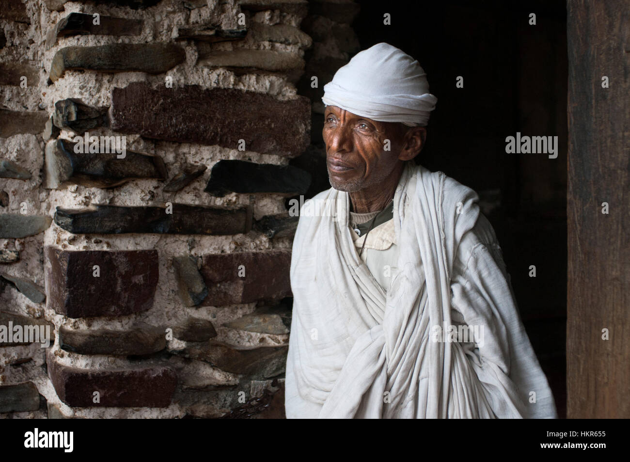 Debre Berhan Selassie Church in Gonder, Ethiopia. A priest at the door ...