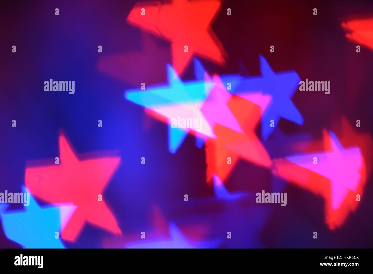 Abstract star patterns against dark background Stock Photo - Alamy