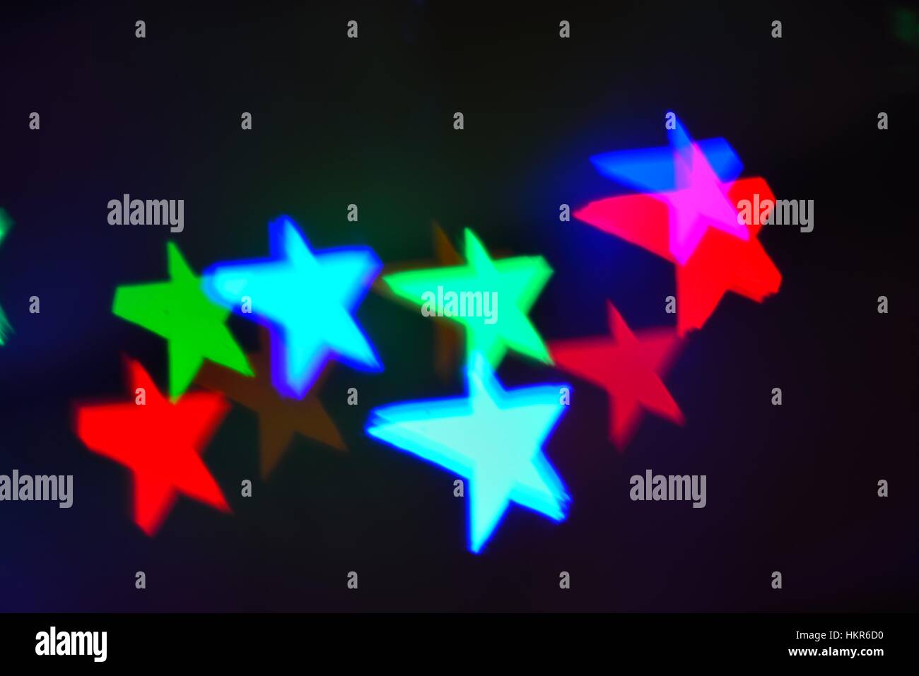 Abstract star patterns against dark background Stock Photo - Alamy
