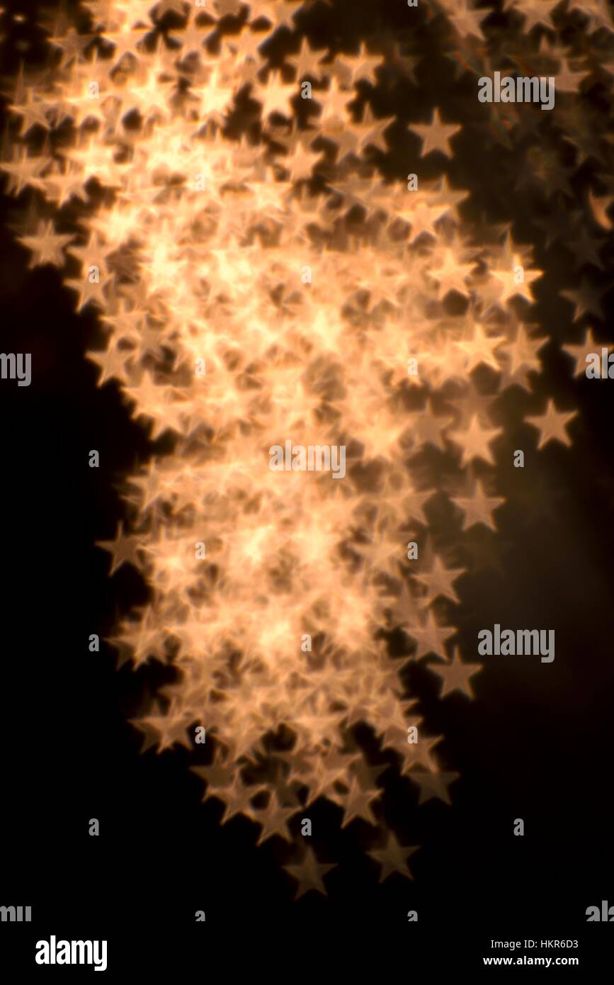 Abstract star patterns against dark background Stock Photo - Alamy