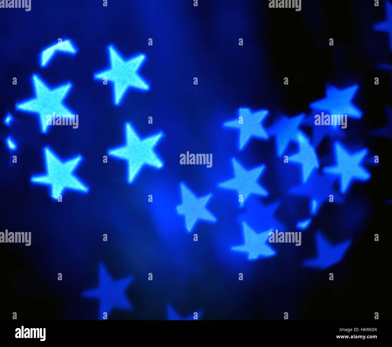 Abstract star patterns against dark background Stock Photo - Alamy