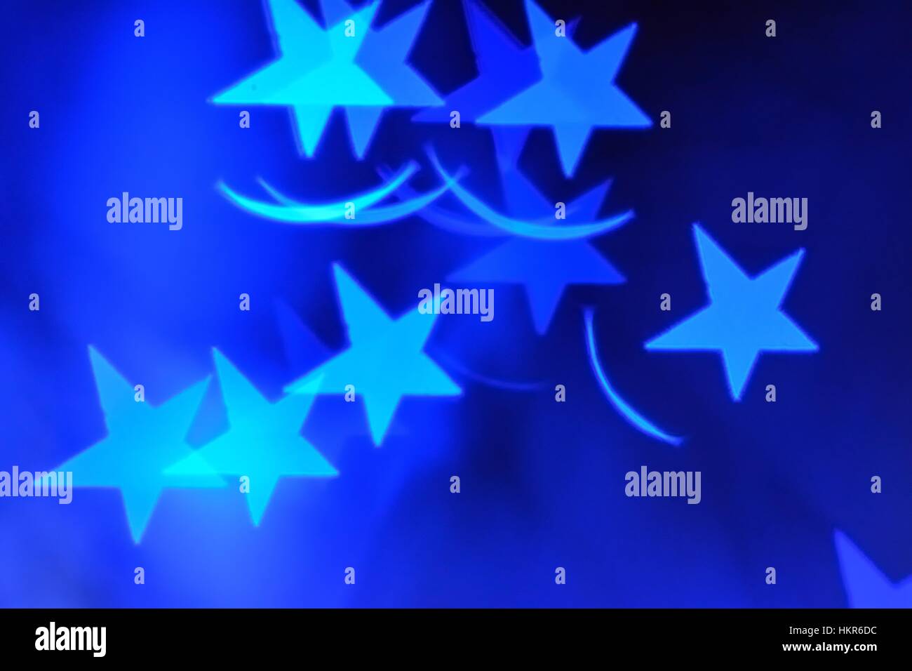 Abstract star patterns against dark background Stock Photo - Alamy