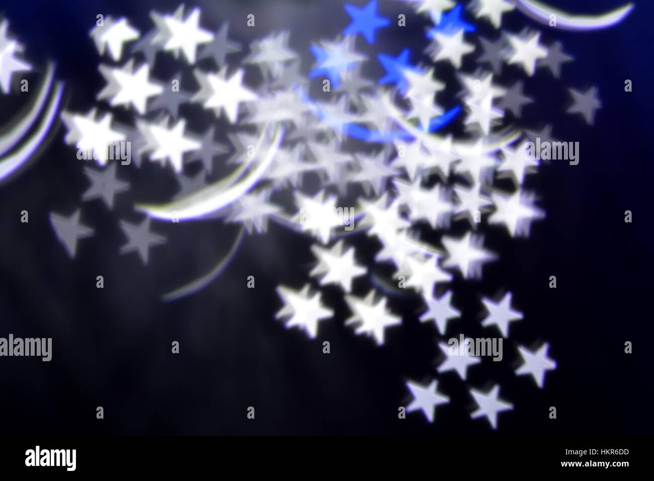 Abstract star patterns against dark background Stock Photo - Alamy