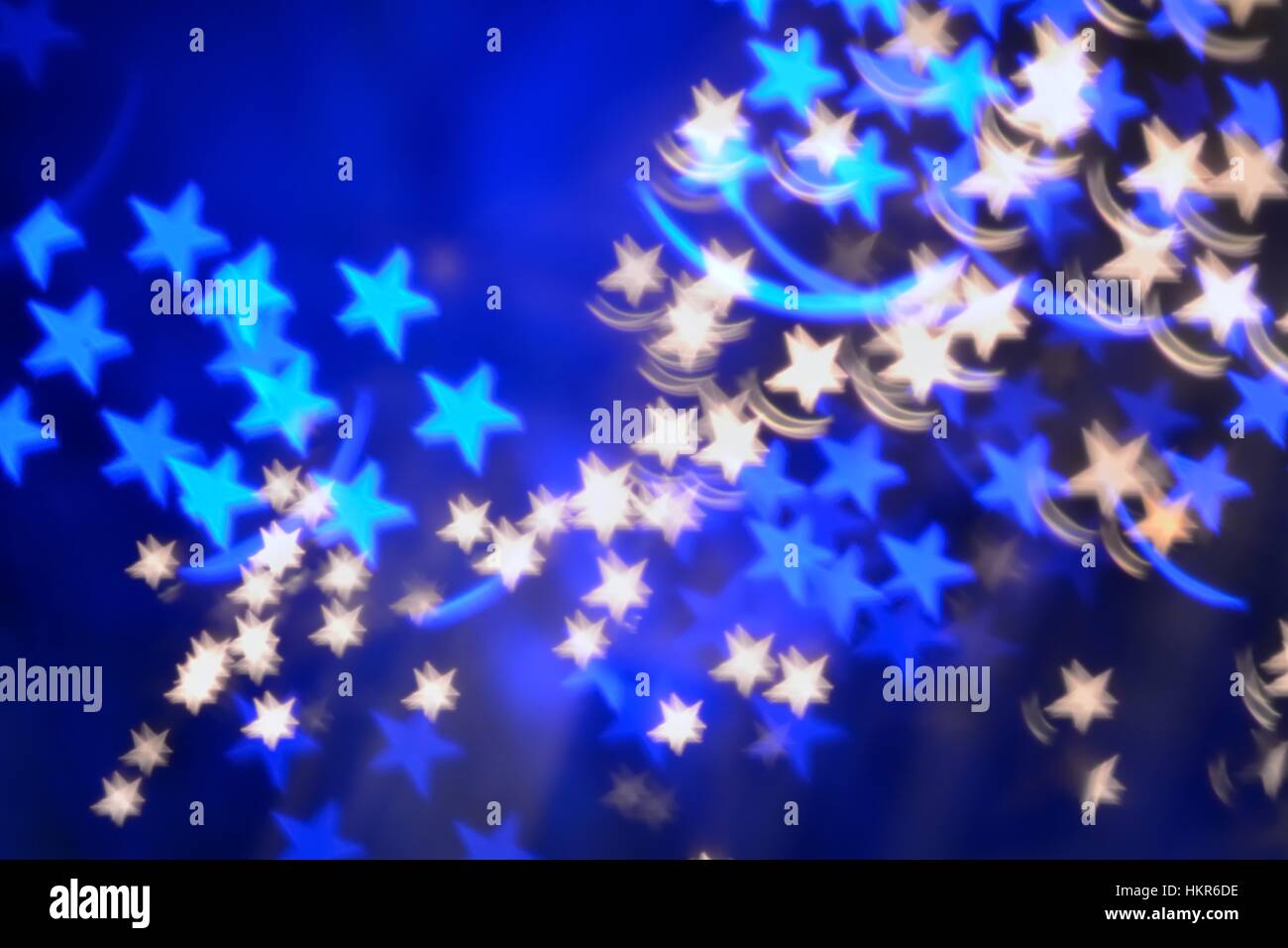 Abstract star patterns against dark background Stock Photo - Alamy