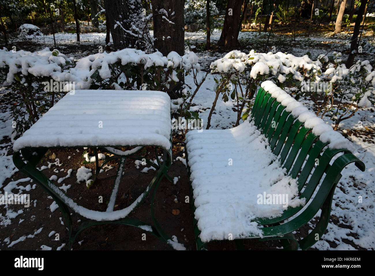 Snow on a bench Stock Photo - Alamy