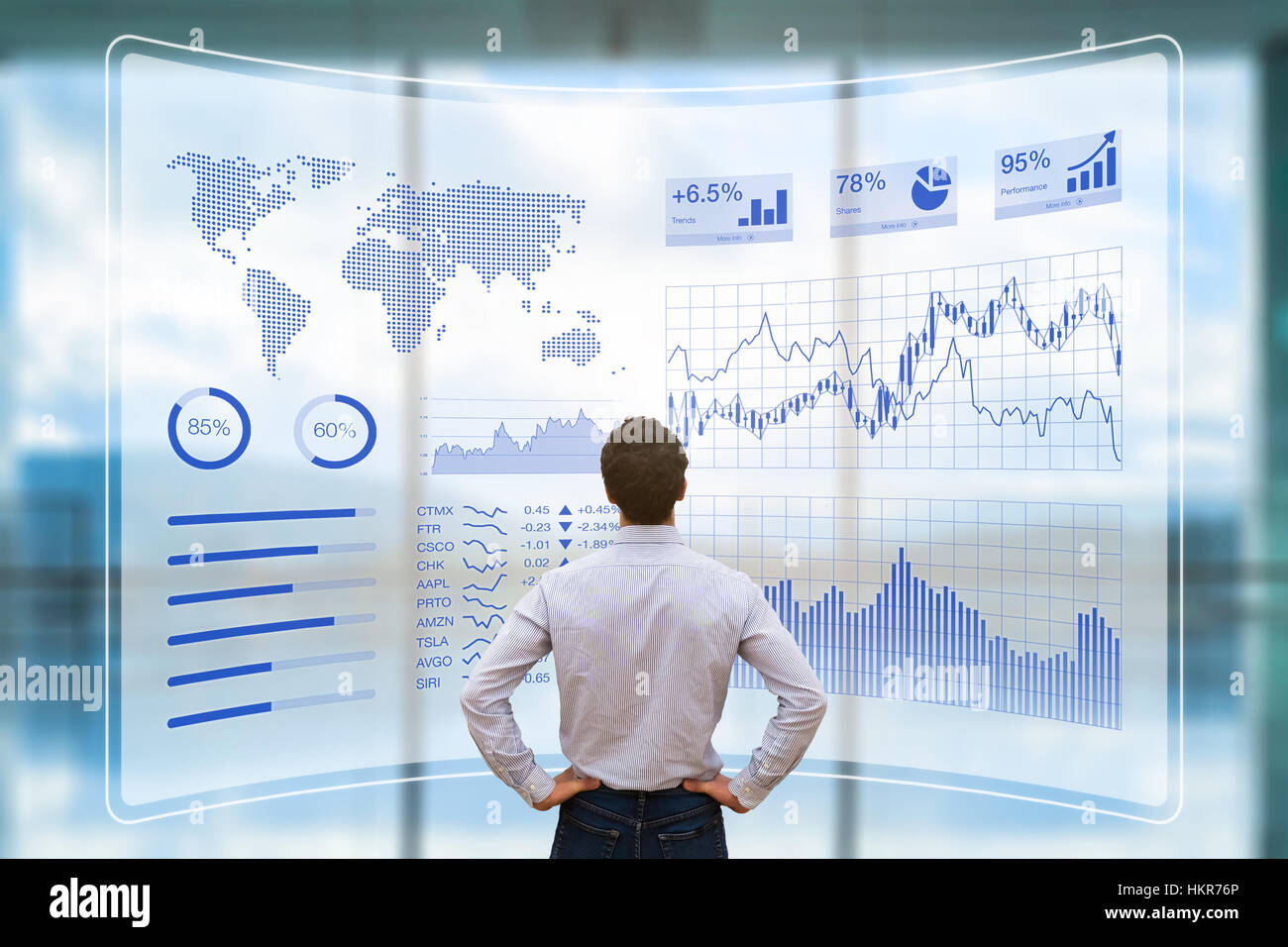 Person using a futuristic head up display (HUD) interface screen with data and key performance ...