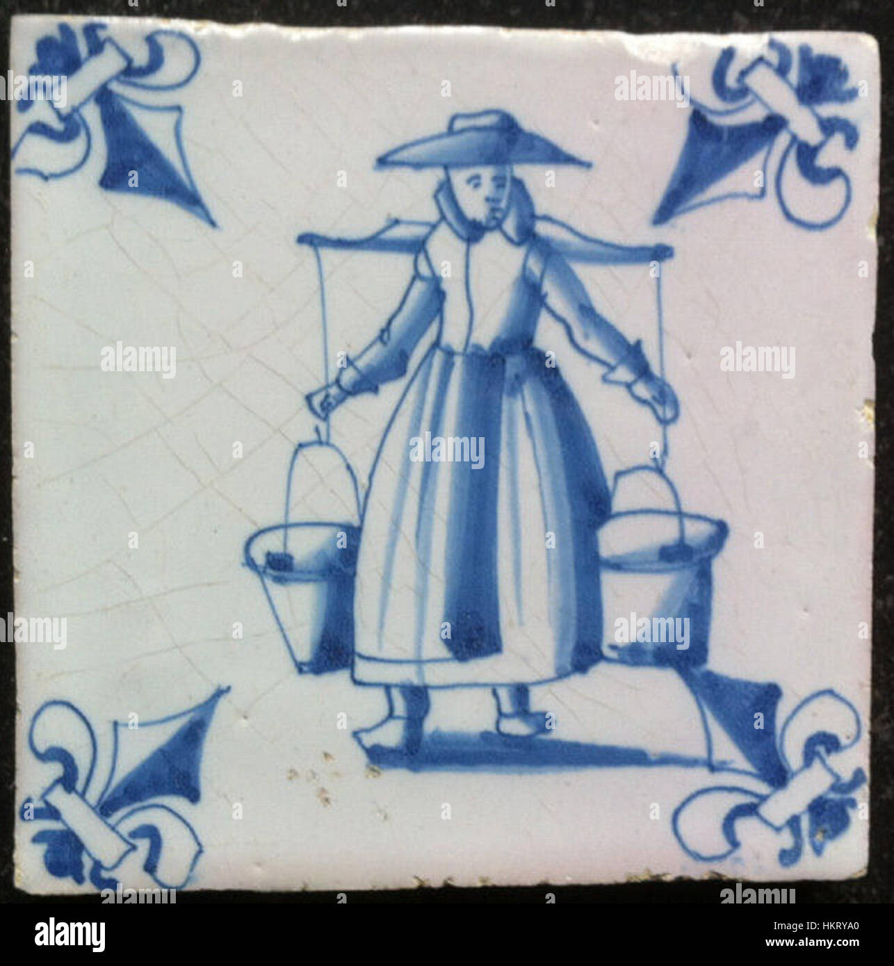 This 1700s Delft tile features the famous *Milkmaid* painting, a ...